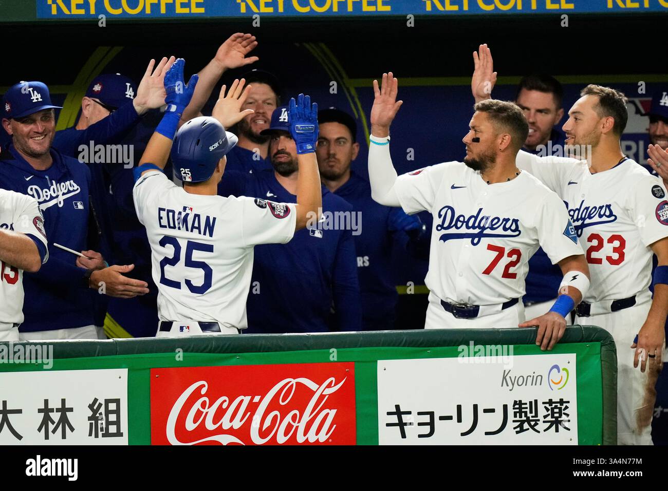 Los Angeles Dodgers' Tommy Edman (25) celebrates with the team in the ...