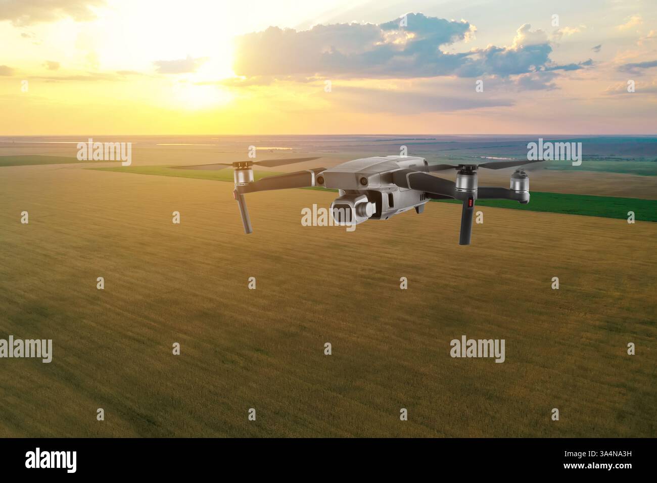 Drone with camera flying over fields. Unmanned aerial vehicle for ...