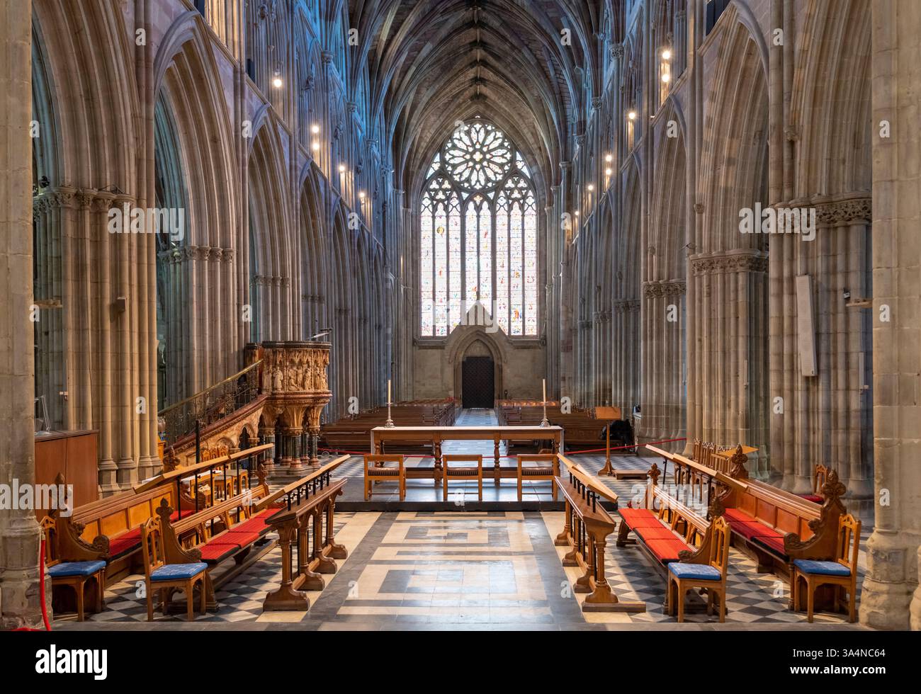 Lit by artificial and late afternoon daylight,featuring the pulpit and ...