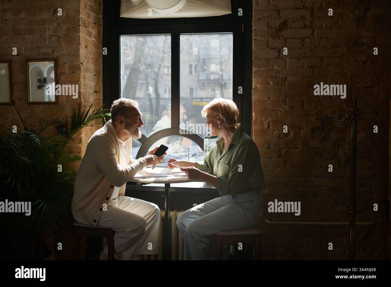 Middle aged couple shares laughter and smiles during their romantic ...