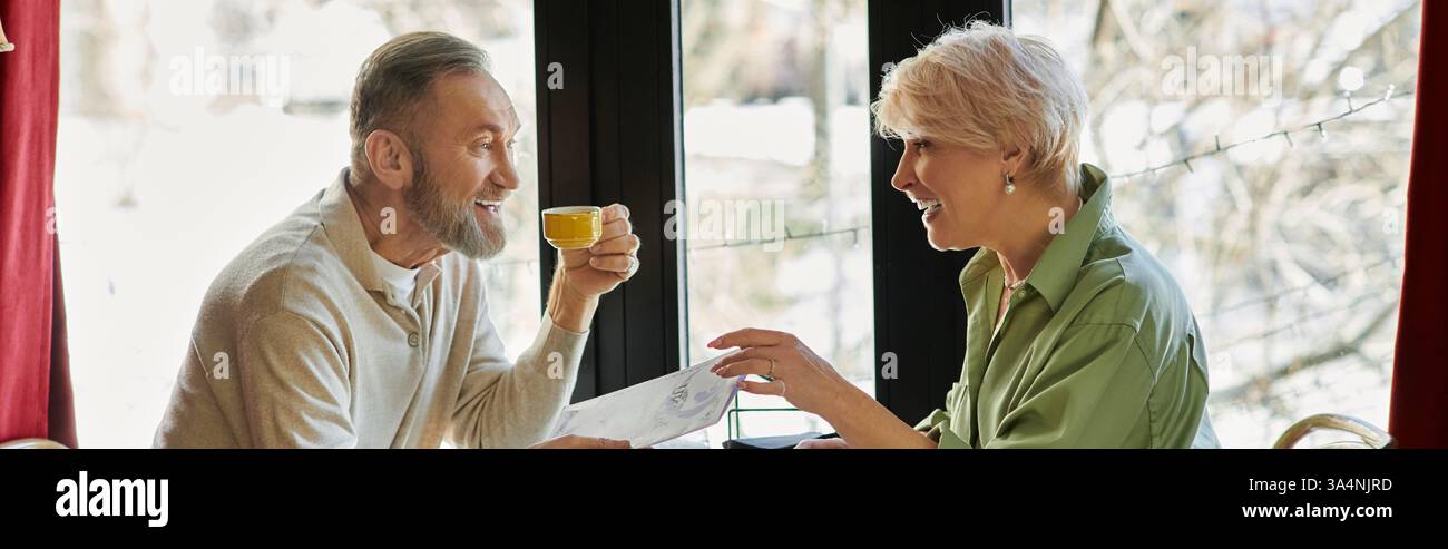 A couple shares laughter over drinks at a cafe, making beautiful ...
