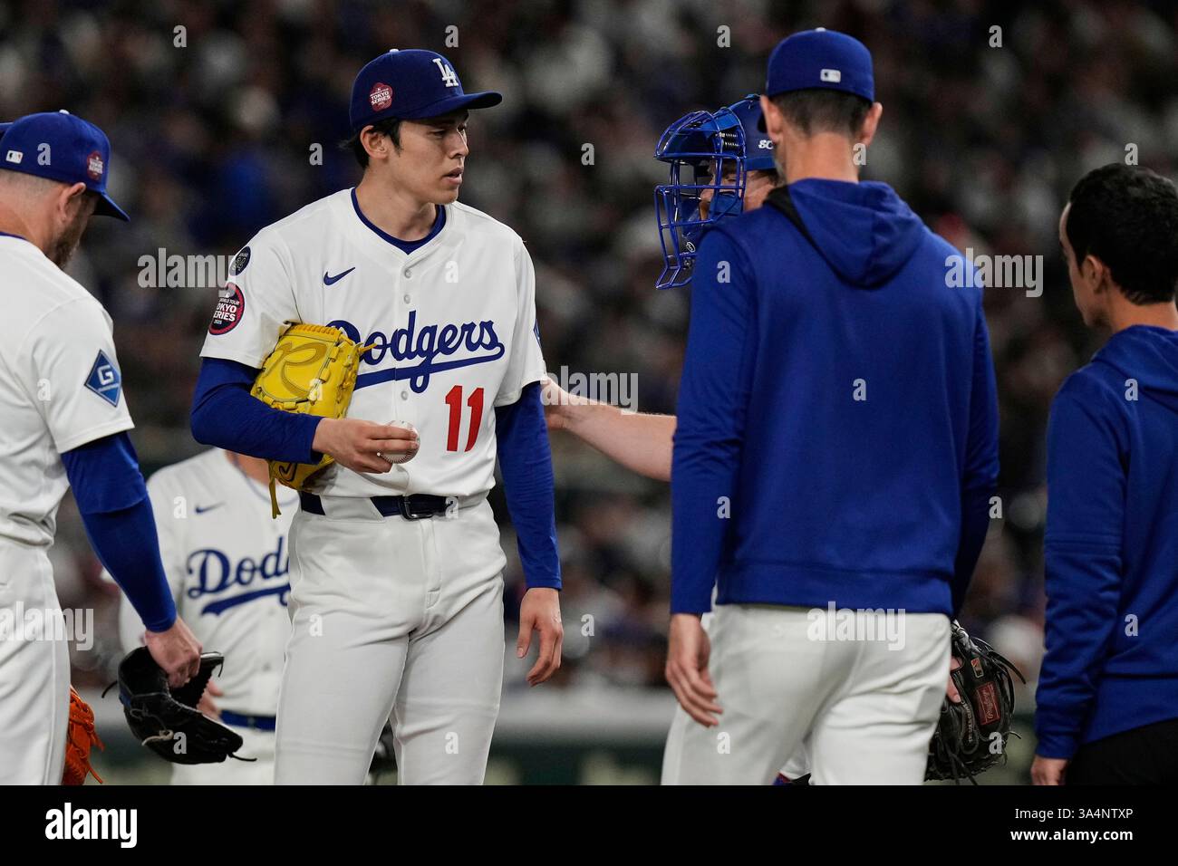 Los Angeles Dodgers starting pitcher Roki Sasaki (11) talks with ...