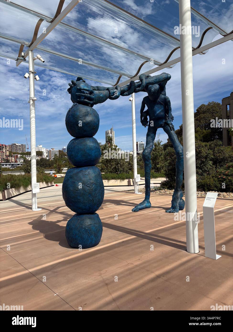Connection is a bronze statue in Sydney, Australia. The statue shows a ...