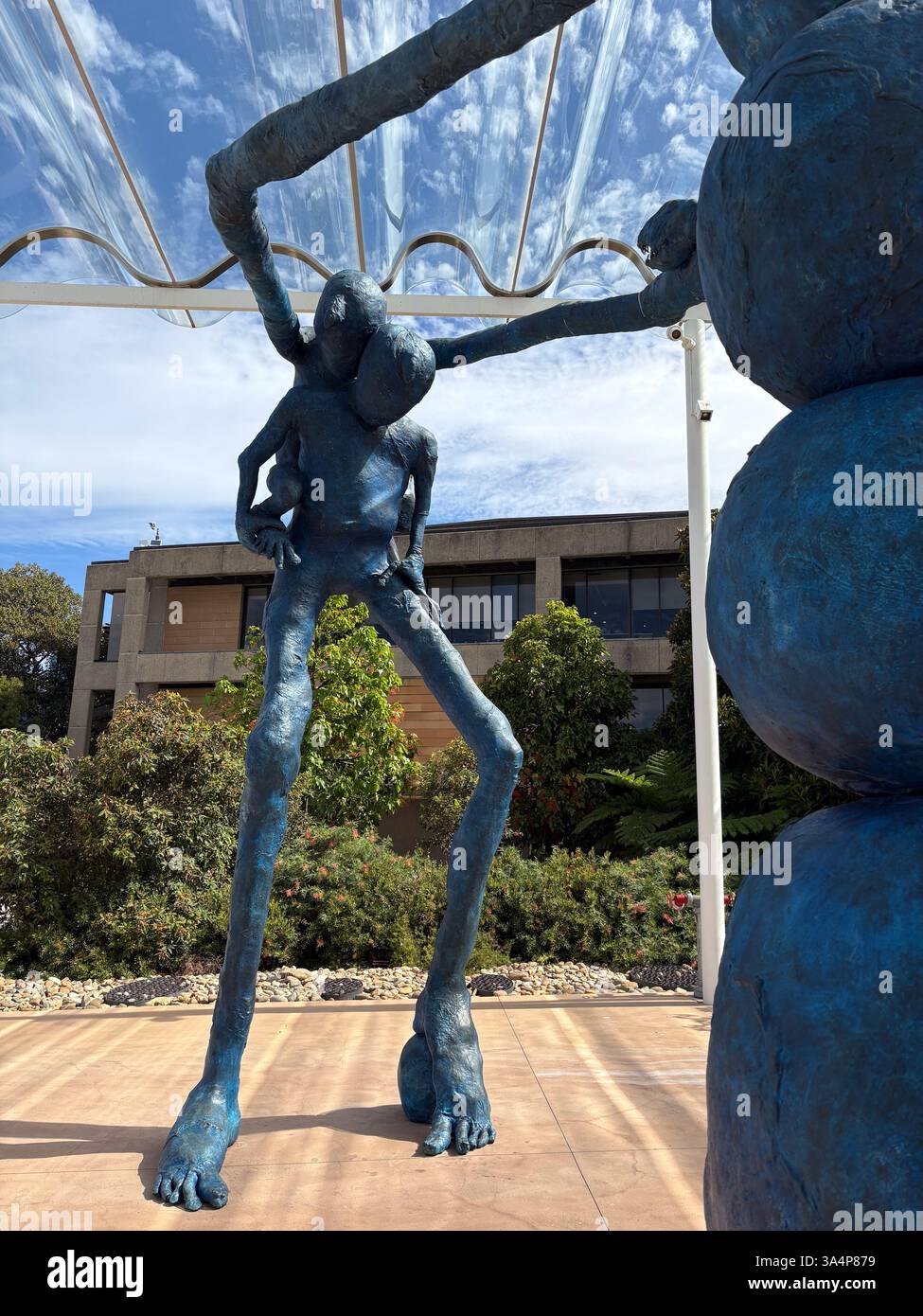 The statue is a blue bronze of kids playing in Sydney Australia. The ...