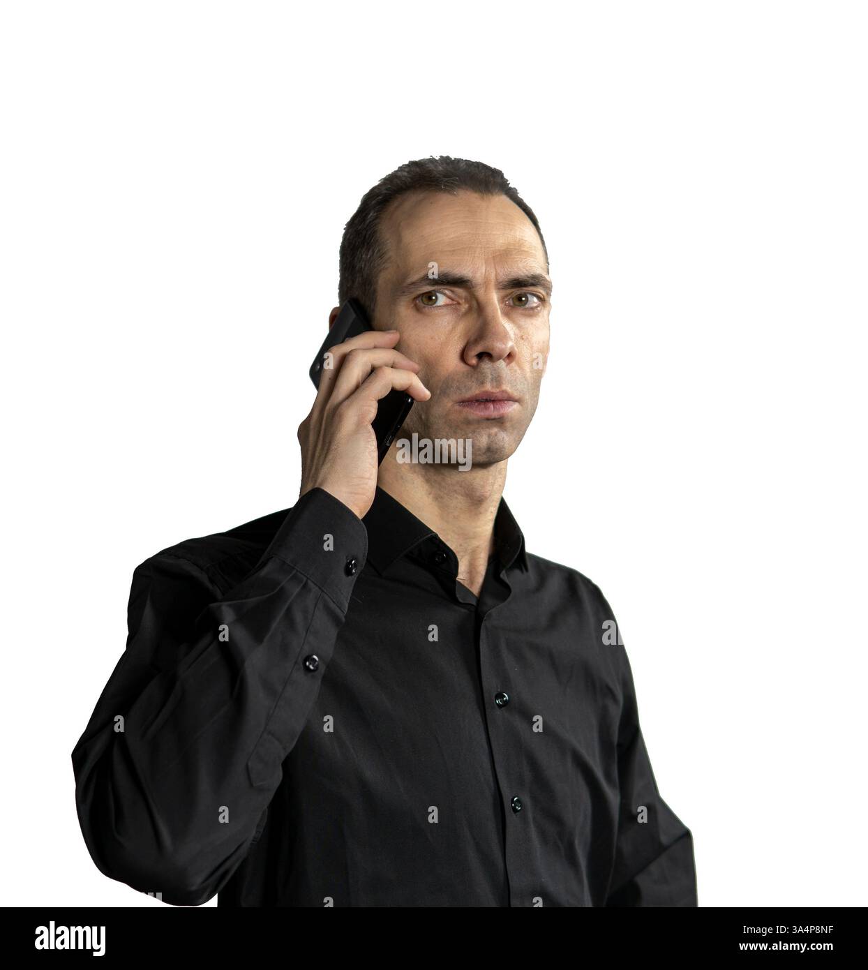 A middle-aged man in profile, wearing a black shirt, is talking on the ...