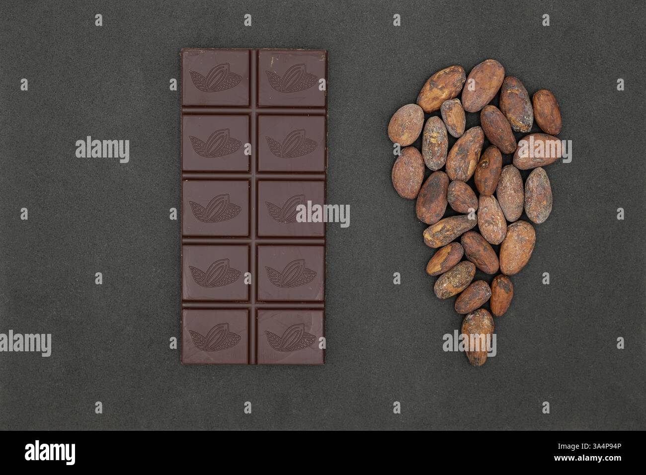 Chocolate bar. Location bubble or pin icon is made from cocoa beans. Black background. Premium ...