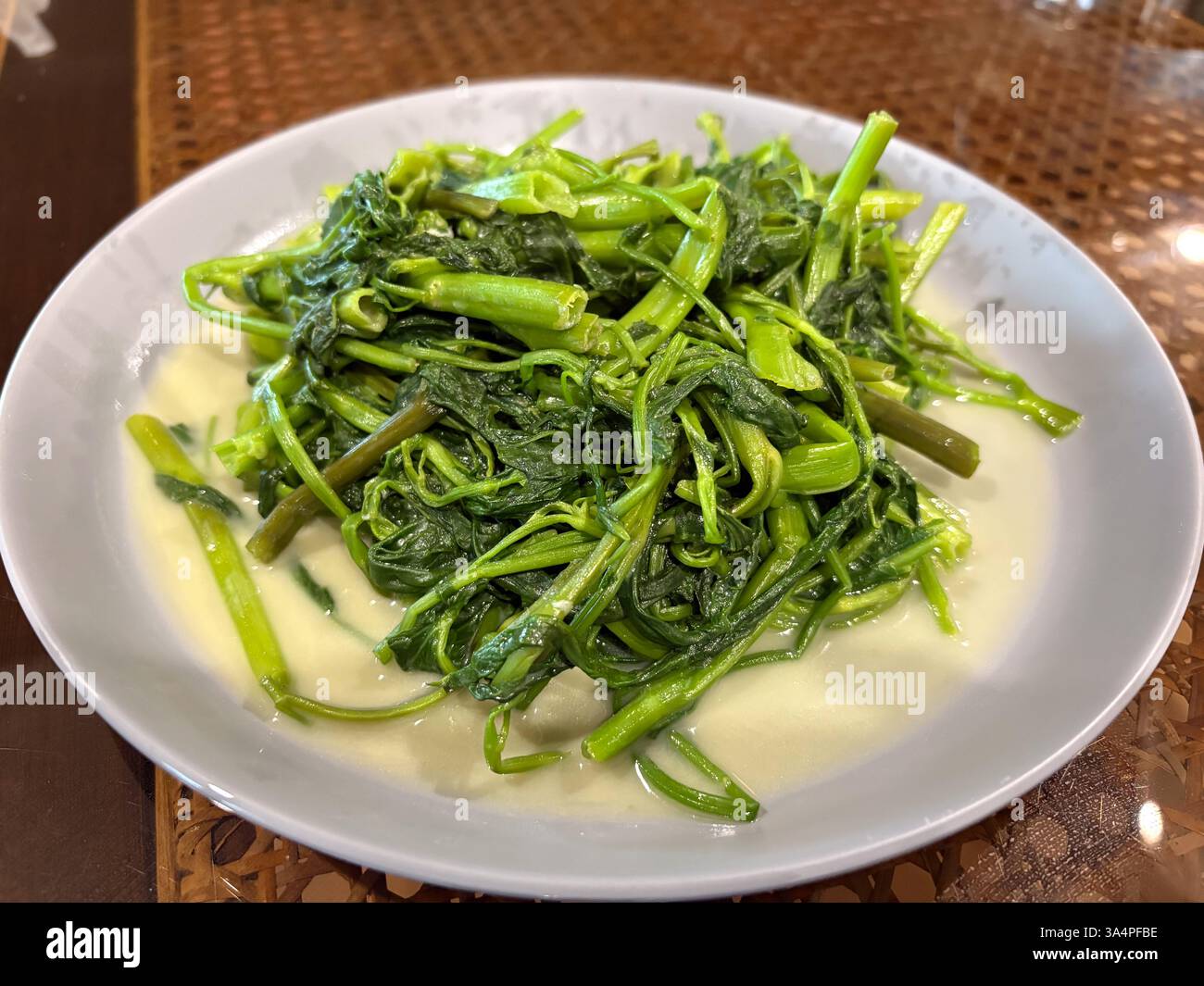 Stir fried water spinach, also known as morning glory or kangkong, is a ...