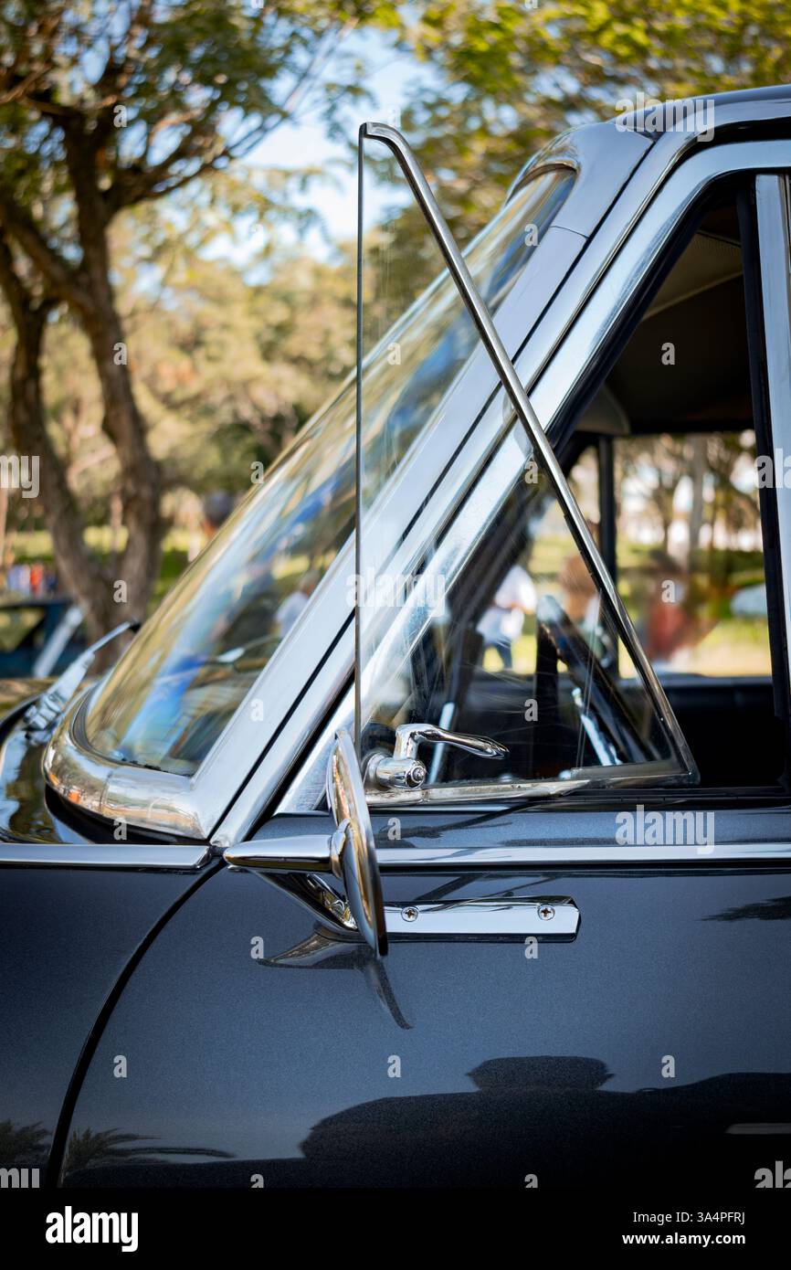 Detail on the partially open front window, highlighting the vintage ...