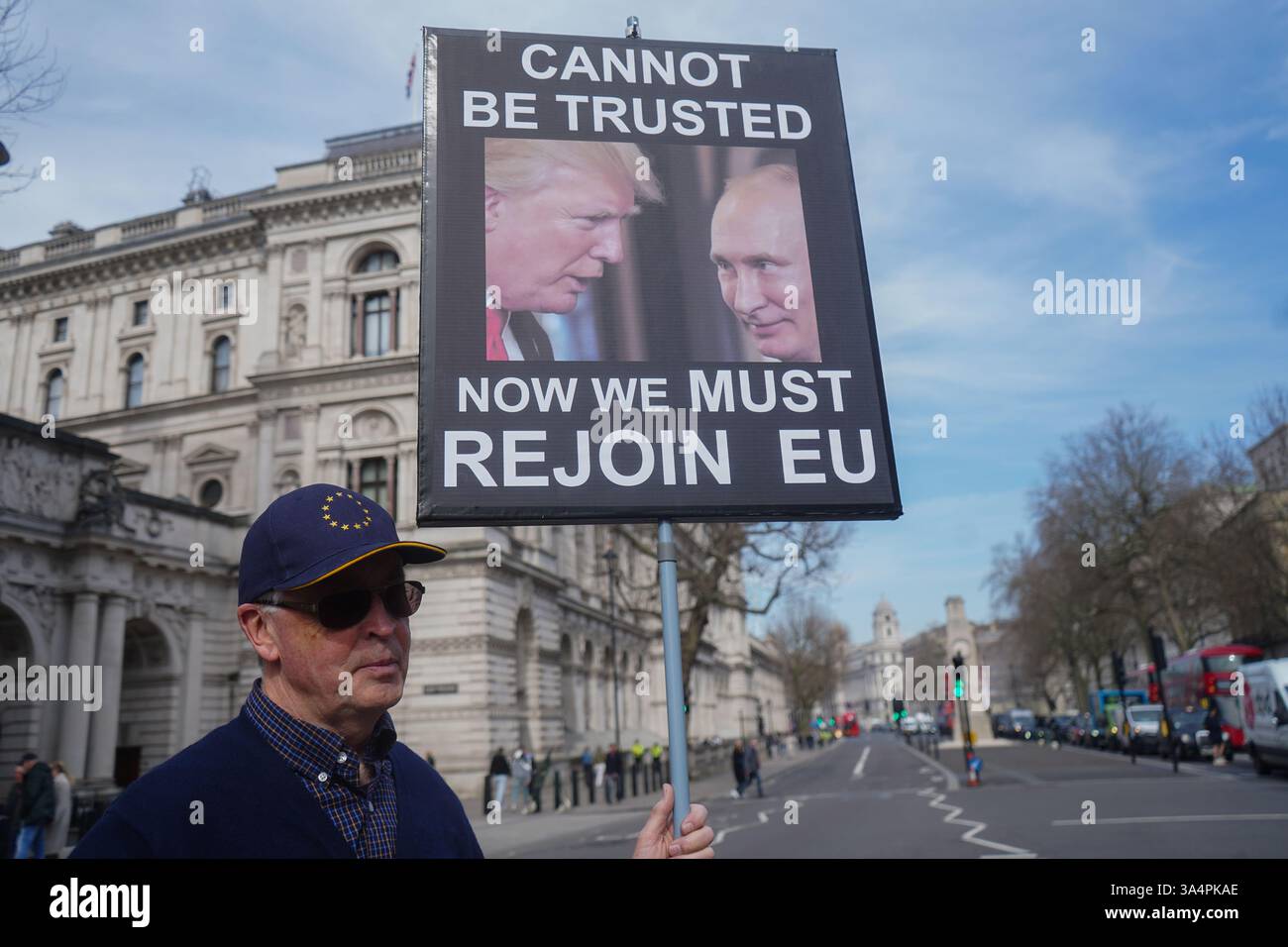 London, UK 19 March 2025. A protester holds a sign in Whitehall with ...