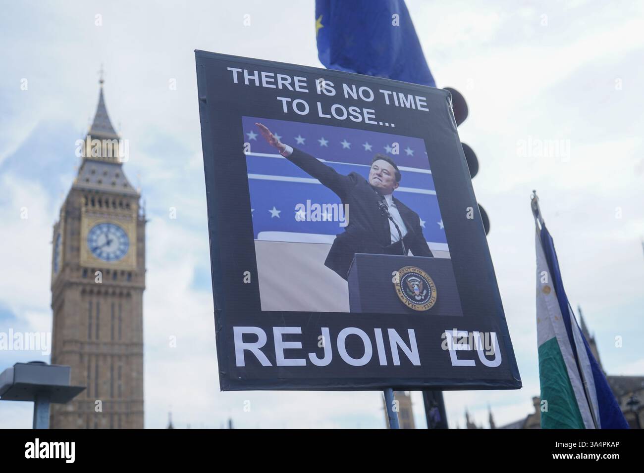 London, UK 19 March 2025. A protester holds a sign in Whitehall with a ...
