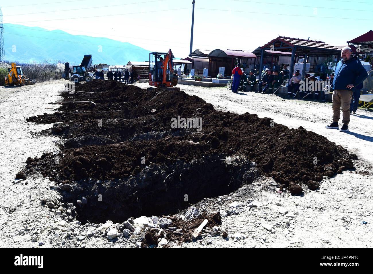 Workers are preparing the graves for the victims of Kocani night club ...