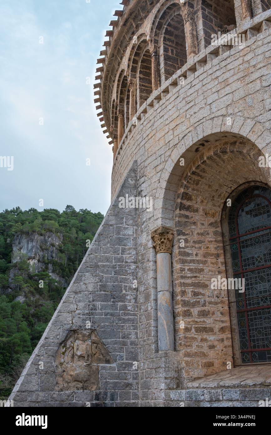 Ancient Romanesque church with arched windows and stone walls ...