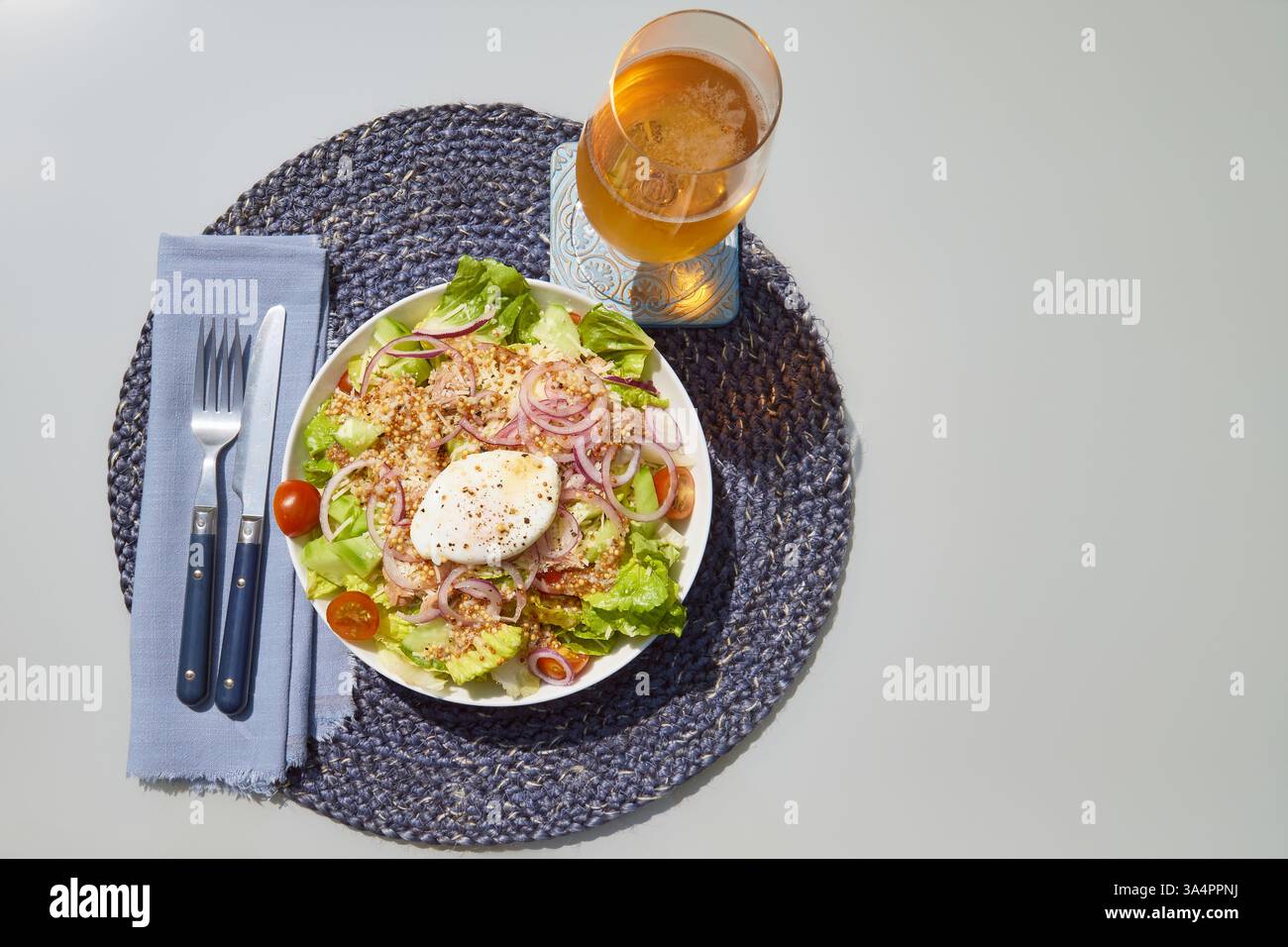A beautifully arranged fresh salad with crisp lettuce, cherry tomatoes ...
