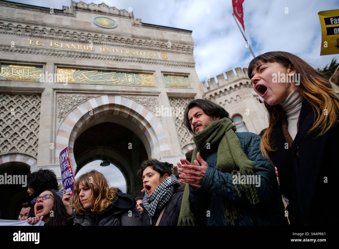 People chant slogans as they protest outside Istanbul University ...