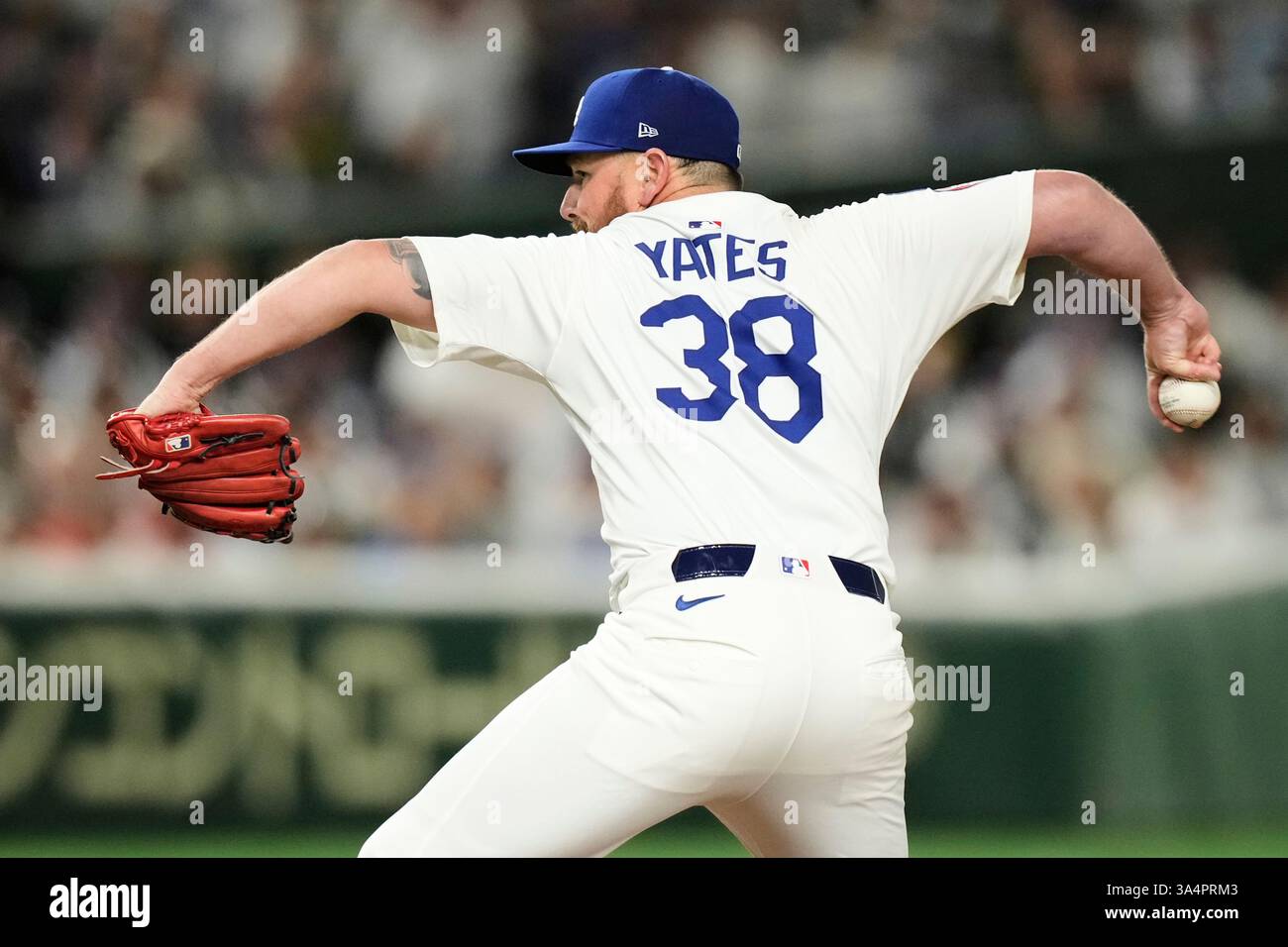 Los Angeles Dodgers relief pitcher Kirby Yates winds up to deliver to ...