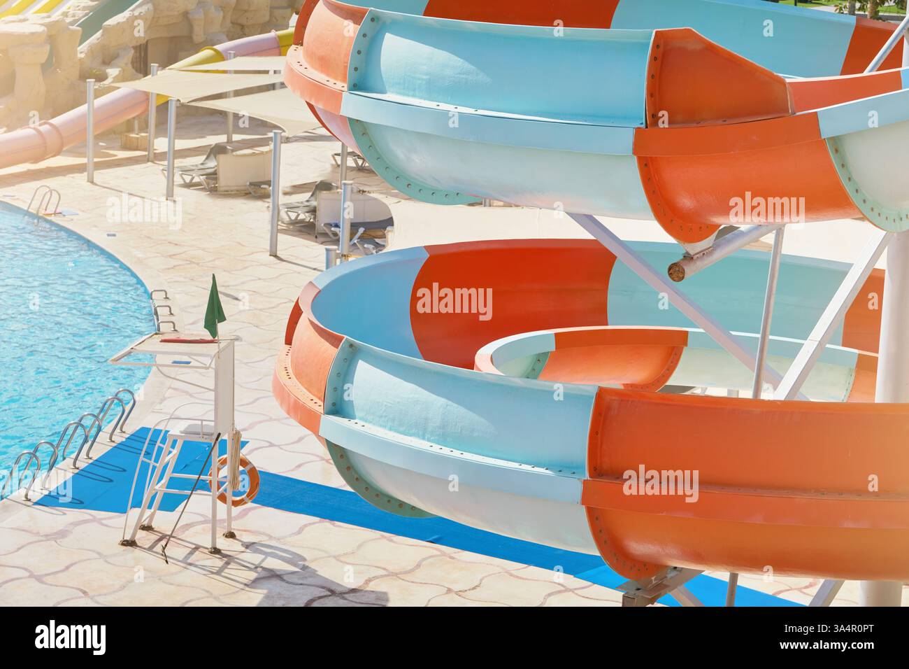 Water park with water colored flights, slides, splashes and pools at ...