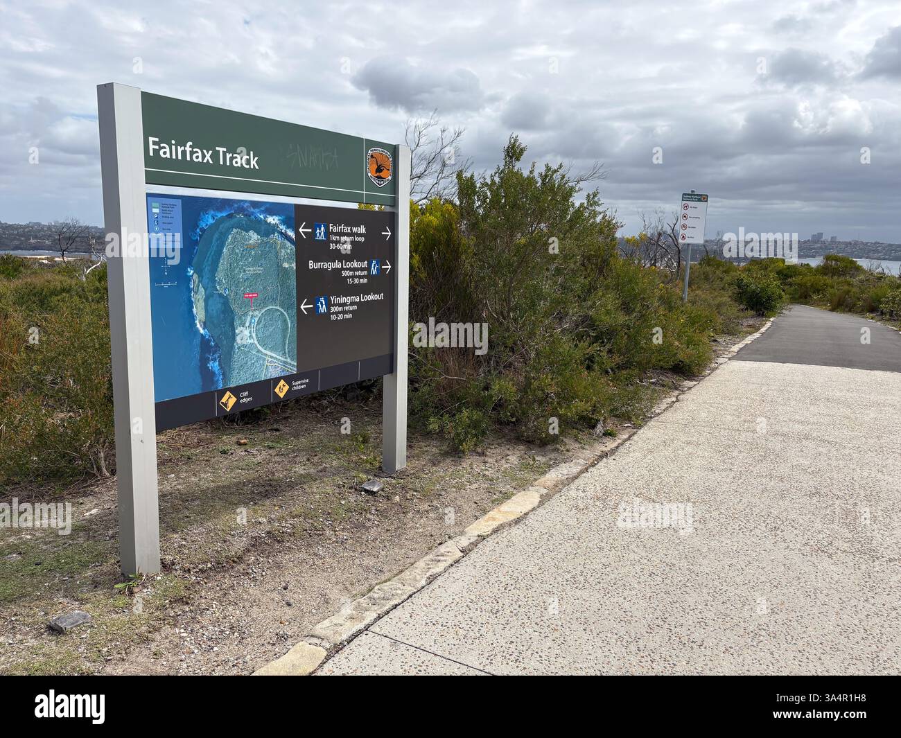 Fairfax track sign at Sydney Harbour National Park. The sign details ...