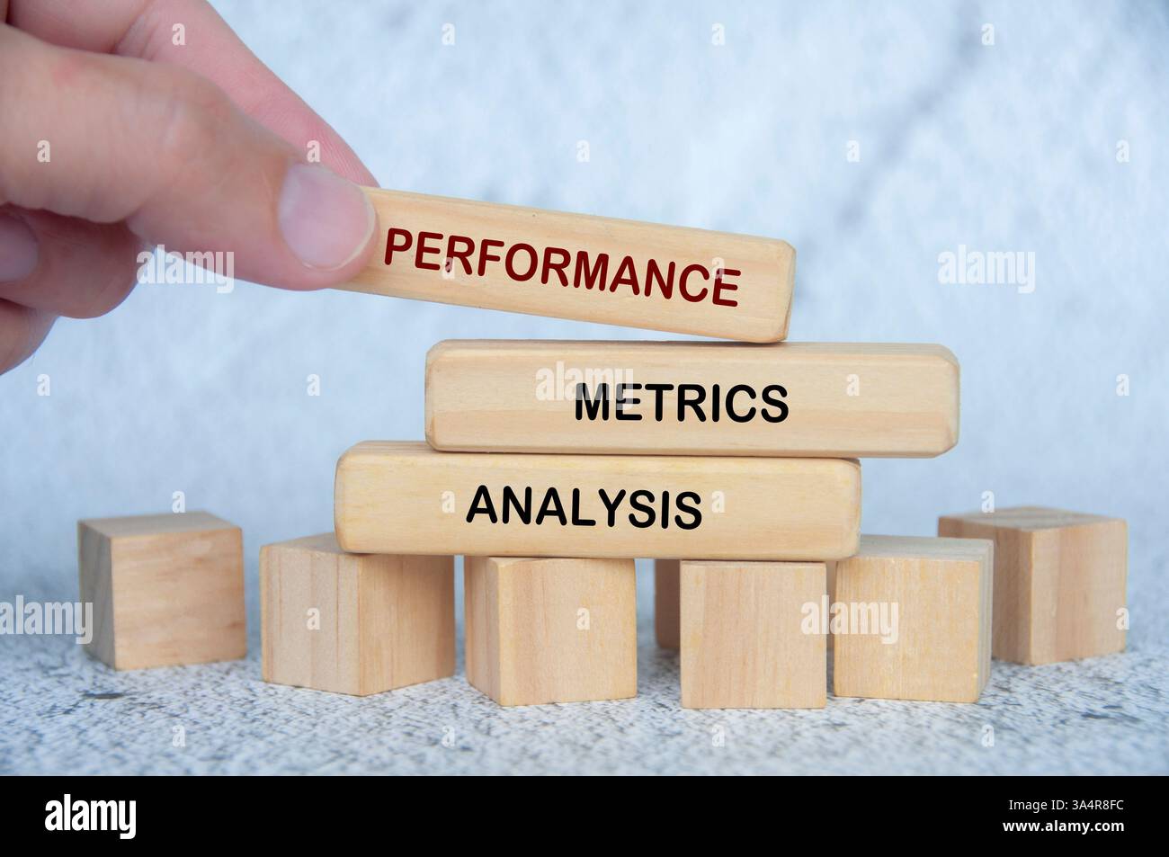 Performance Metrics Analysis text on wooden blocks. Strategic business ...