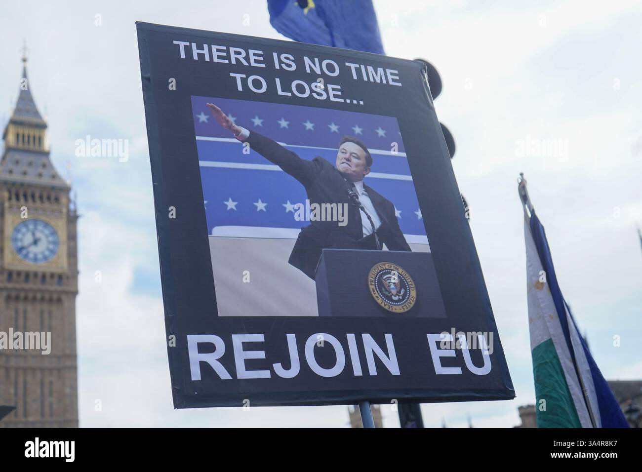 London, UK 19 March 2025. A protester holds a sign in Whitehall with a ...