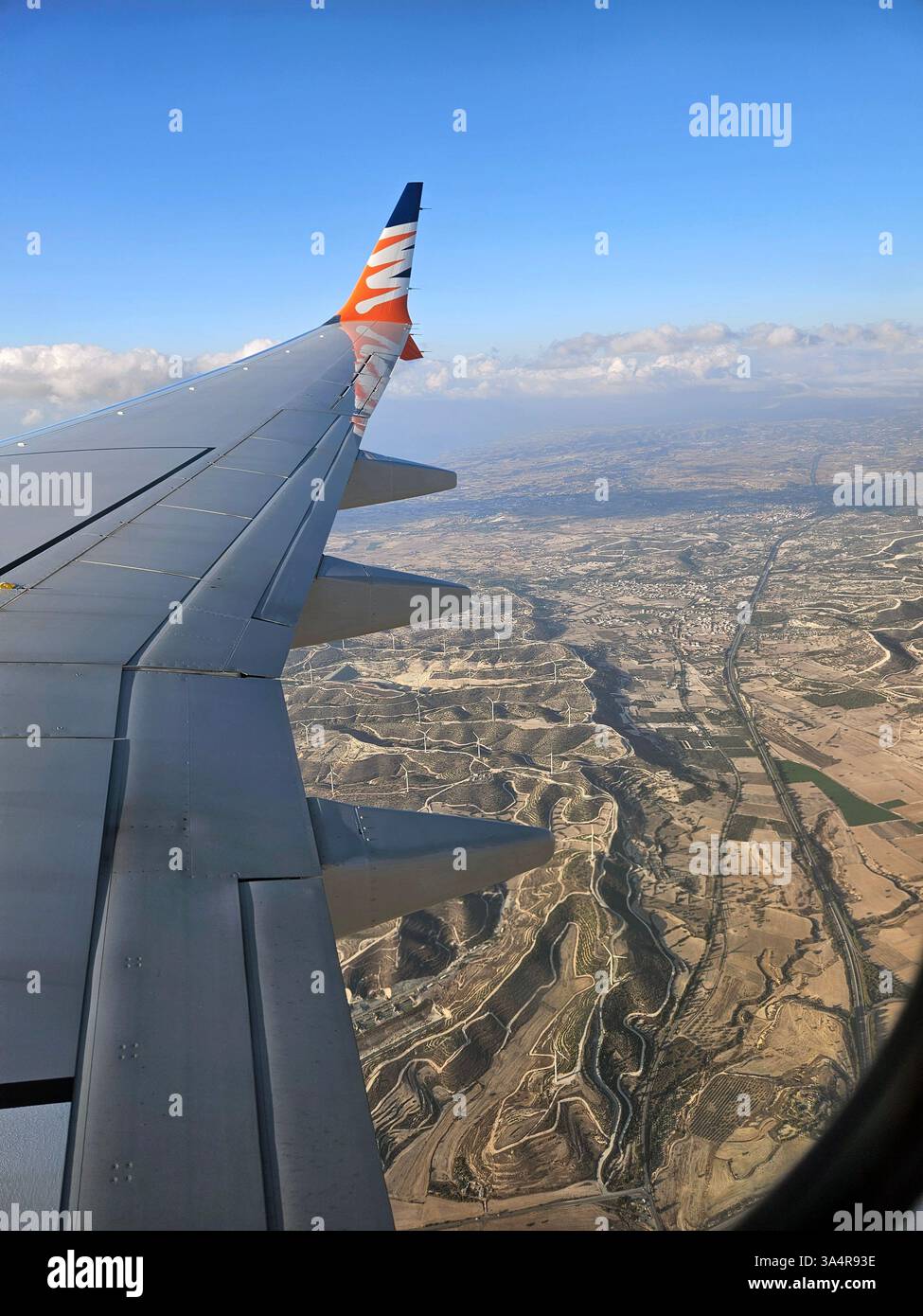 A breathtaking aerial view from a plane window, showcasing vast skies ...