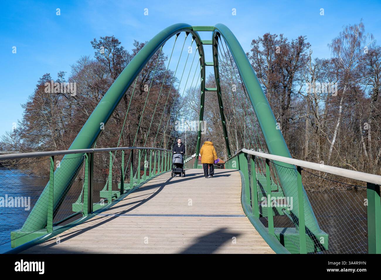 The New Five-Penny bridge at waterfront park Åbackarna across Motala ...