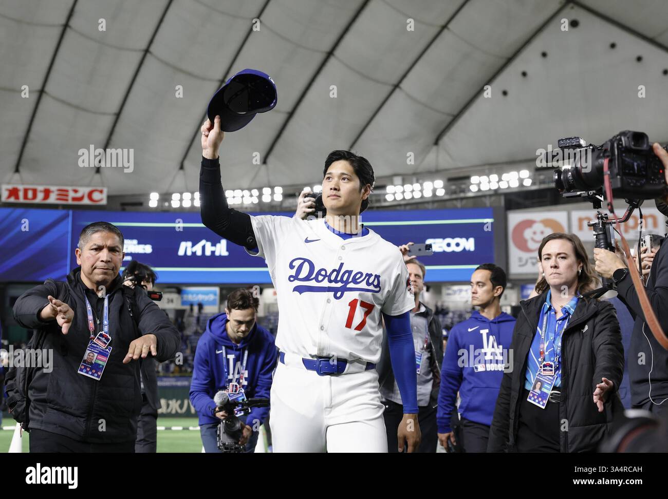 Los Angeles Dodgers designated hitter Shohei Ohtani waves to the crowd ...