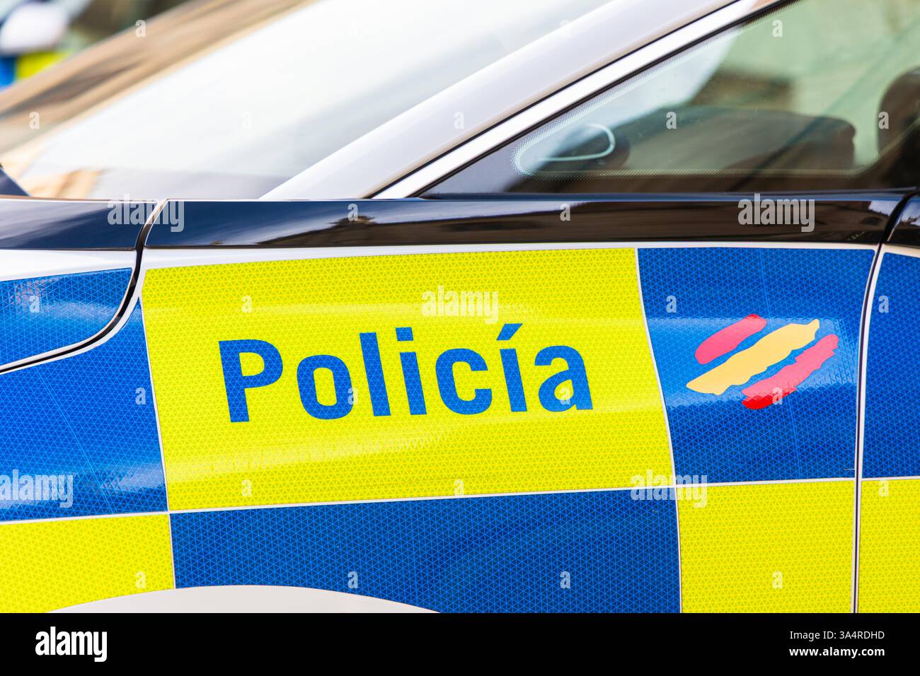A close-up view of a Spanish police car displaying the word "Policía ...