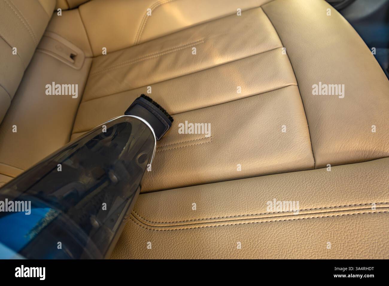 Handheld small battery-powered vacuum cleaner, cleaning rubbish in the ...