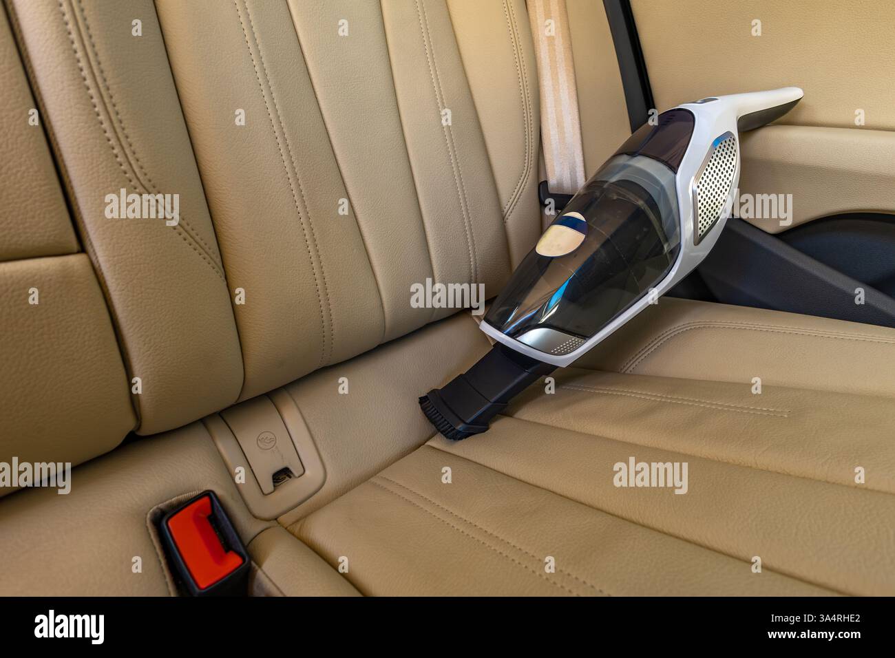 Handheld small battery-powered vacuum cleaner, cleaning rubbish in the ...