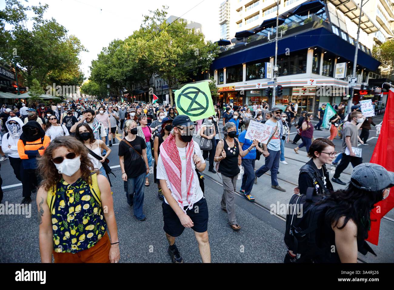 A large group of protesters chants slogans during the rally. The rally ...