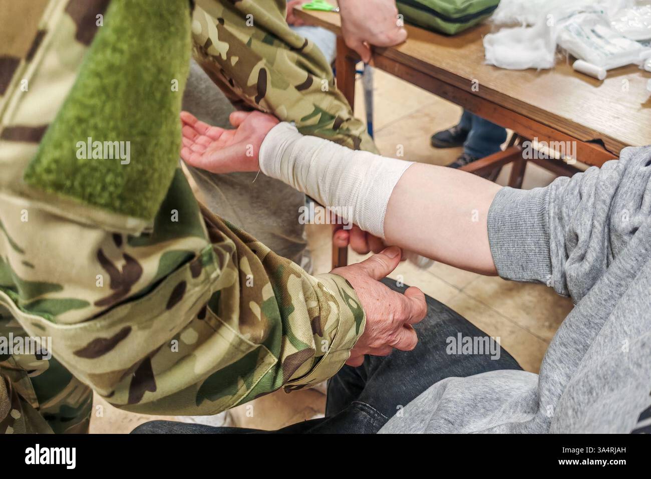 First aid practice for bandaging an injured arm Stock Photo - Alamy