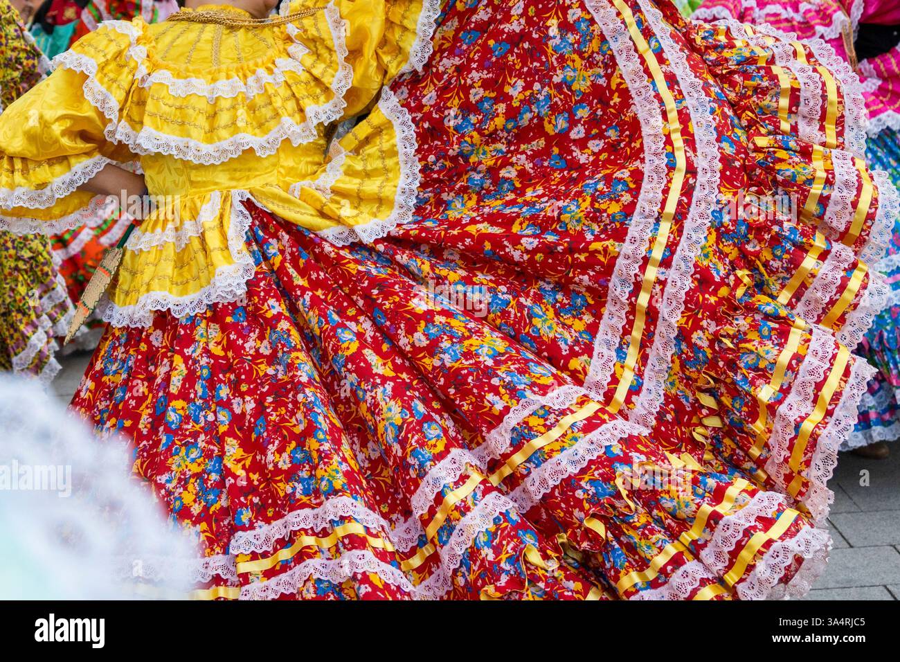 Colorful clothes of traditional Mexican folklore dancers in motion ...