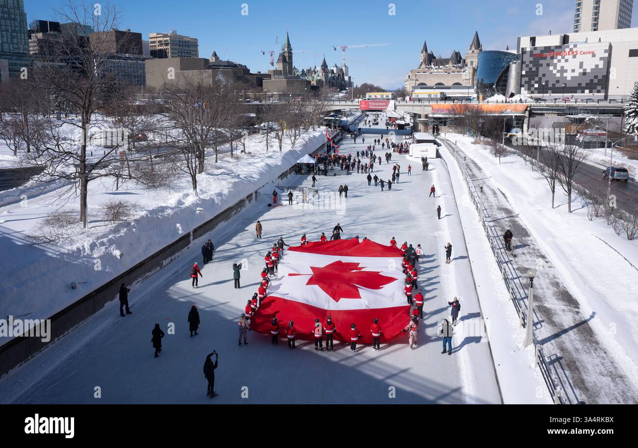 Ottawa, Canada. 14th Feb, 2025. Local youth skate with a large Canadian ...