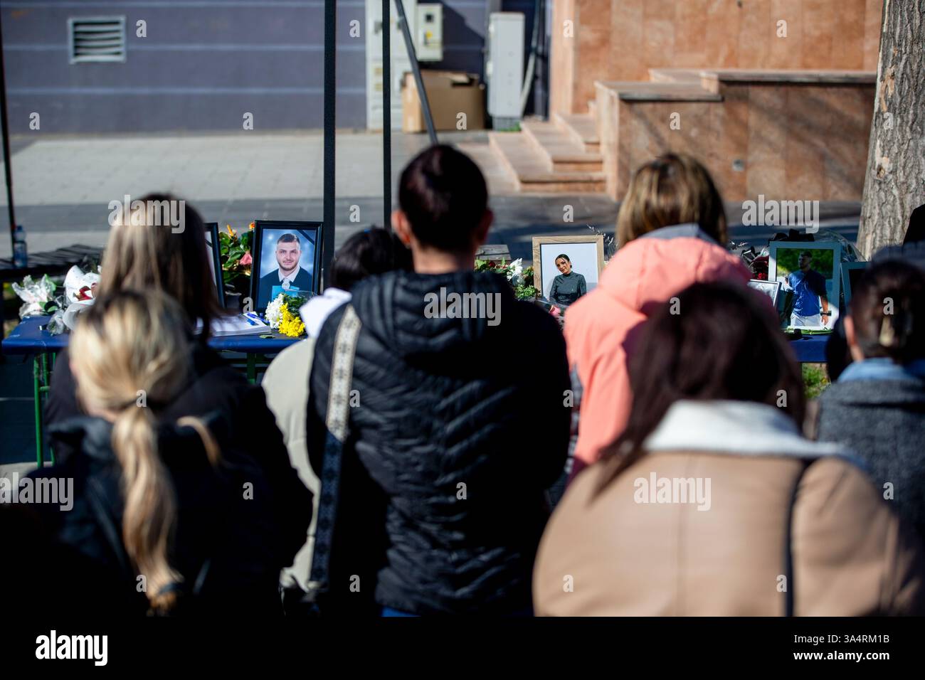 People gather to pay their tribute during a vigil for the victims of a ...
