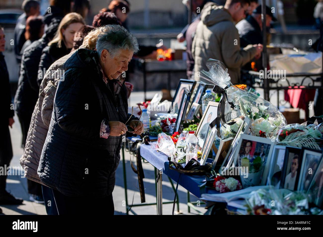 People gather to pay their tribute during a vigil for the victims of a ...