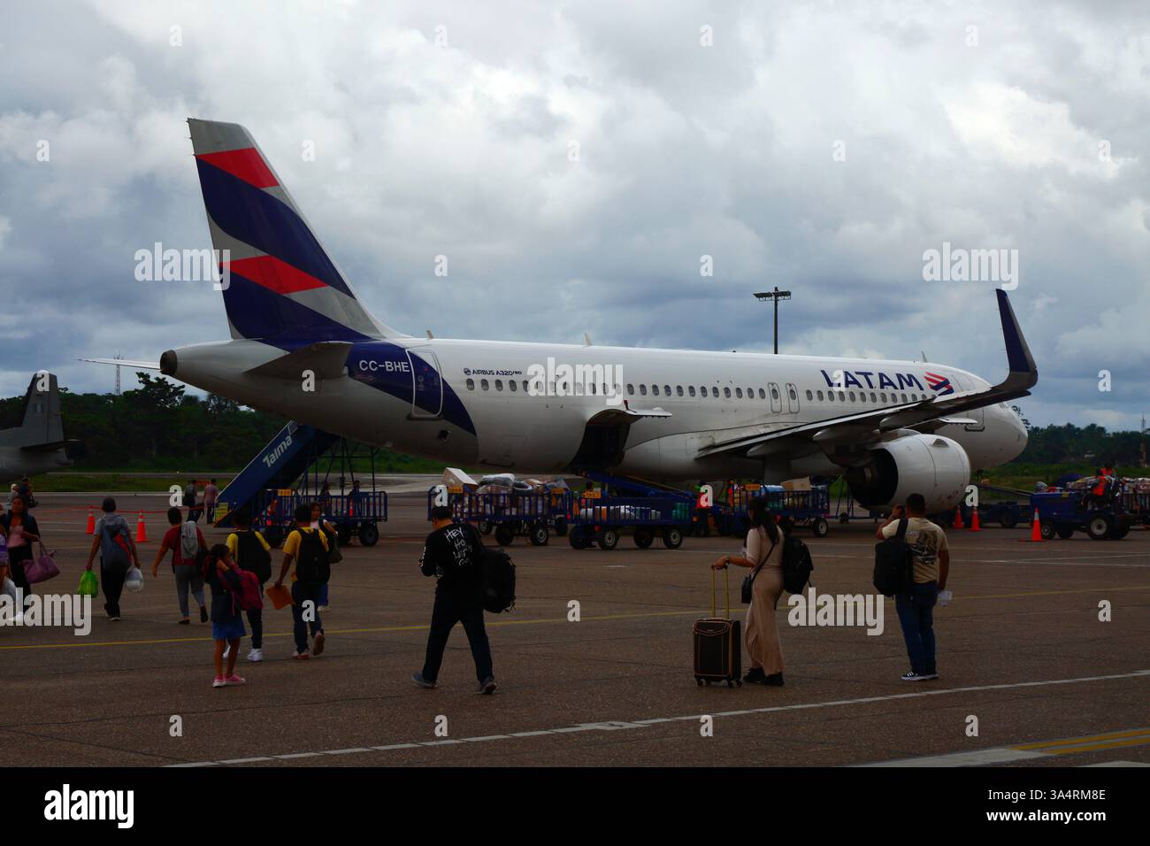 Passengers boarding Airbus A320-271N aircraft CC-BHE belonging to LATAM ...