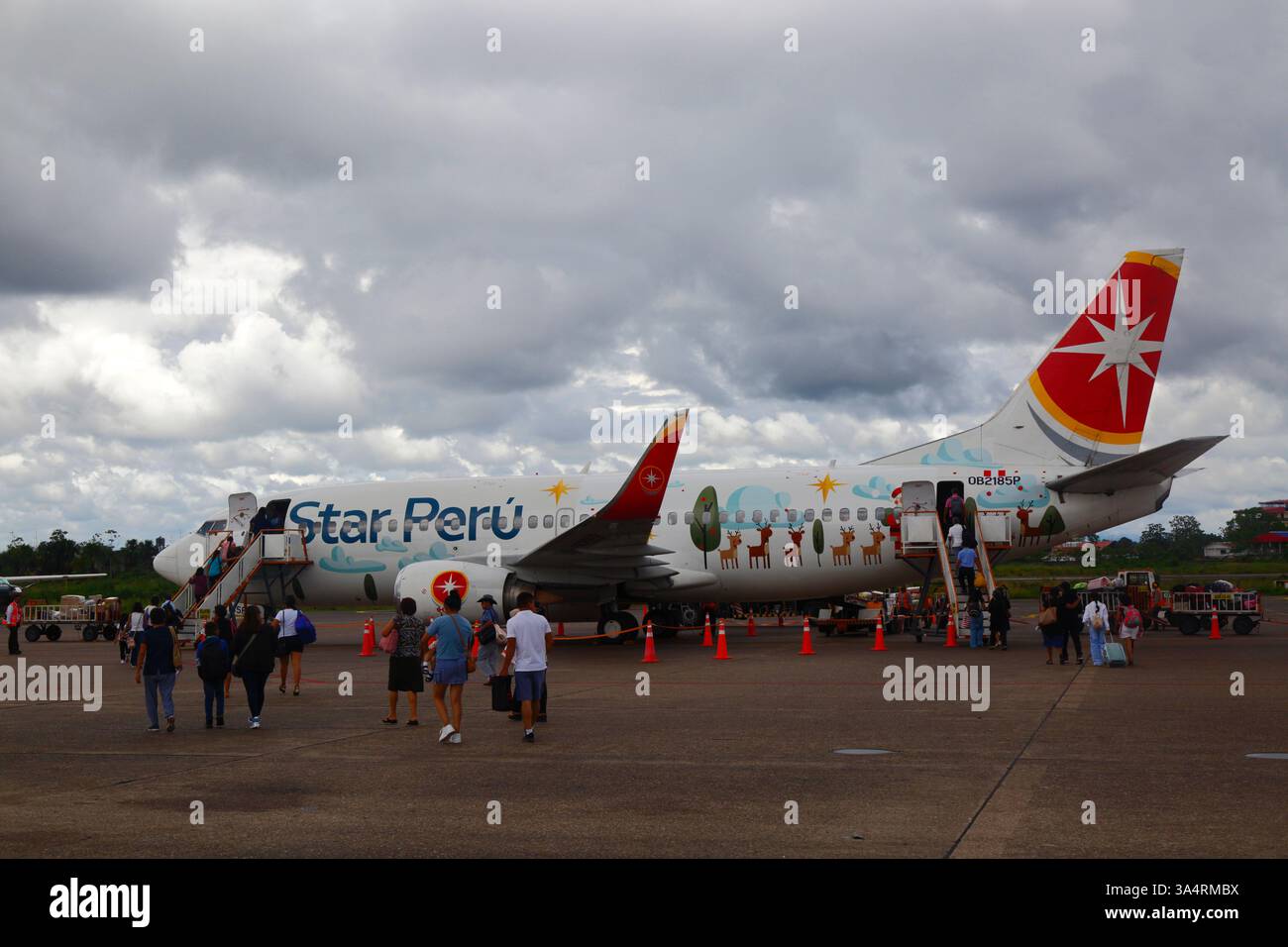 Passengers boarding Boeing 737-3H4 aircraft OB-2185-P belonging to Star ...