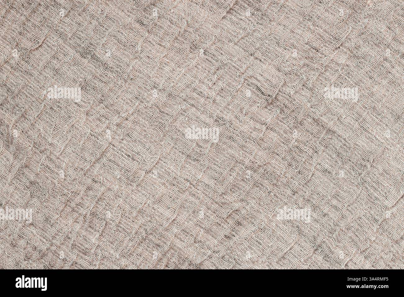 Beige linen fabric texture with folds. Worn linen fabric texture with ...