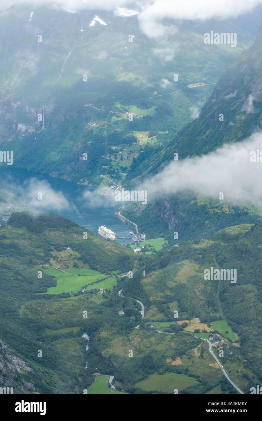 Aerial view of the Geirangerfjord valley in Norway with misty clouds ...