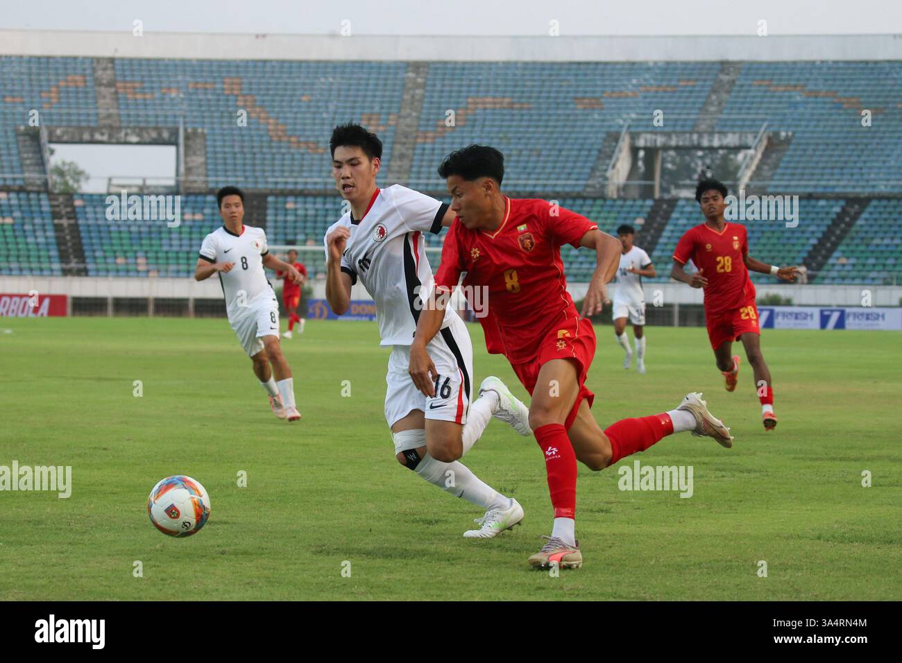 Yangon, Myanmar. 19th Mar, 2025. Zwe Manh Thar (R) of Myanmar vies with ...