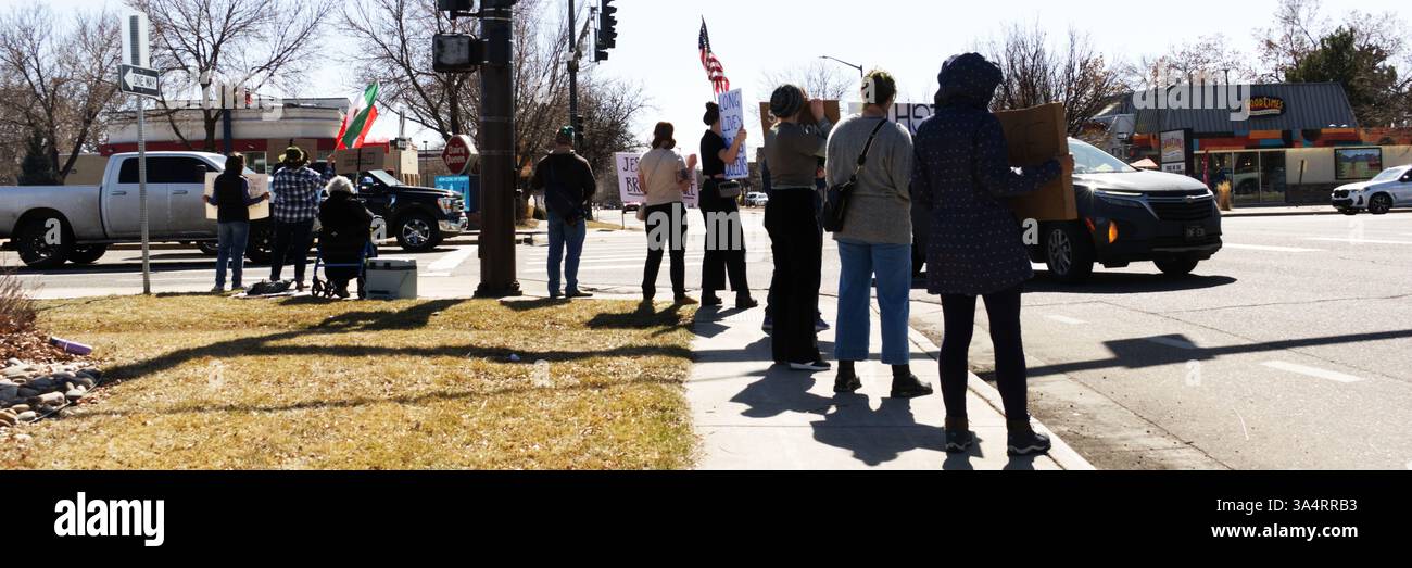 A lineup of activists protesting in Loveland Colorado 2025 Stock Photo ...