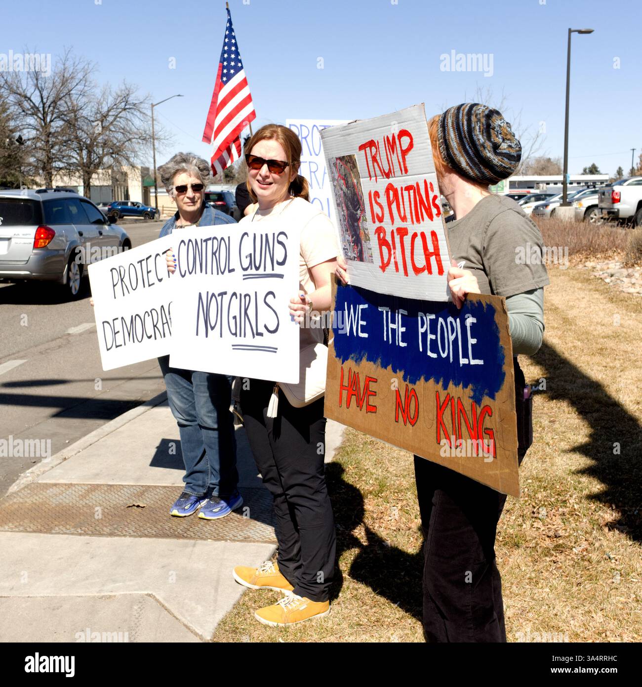 Civil rights activists stand at a takedown Tesla rally March 2025 Stock ...