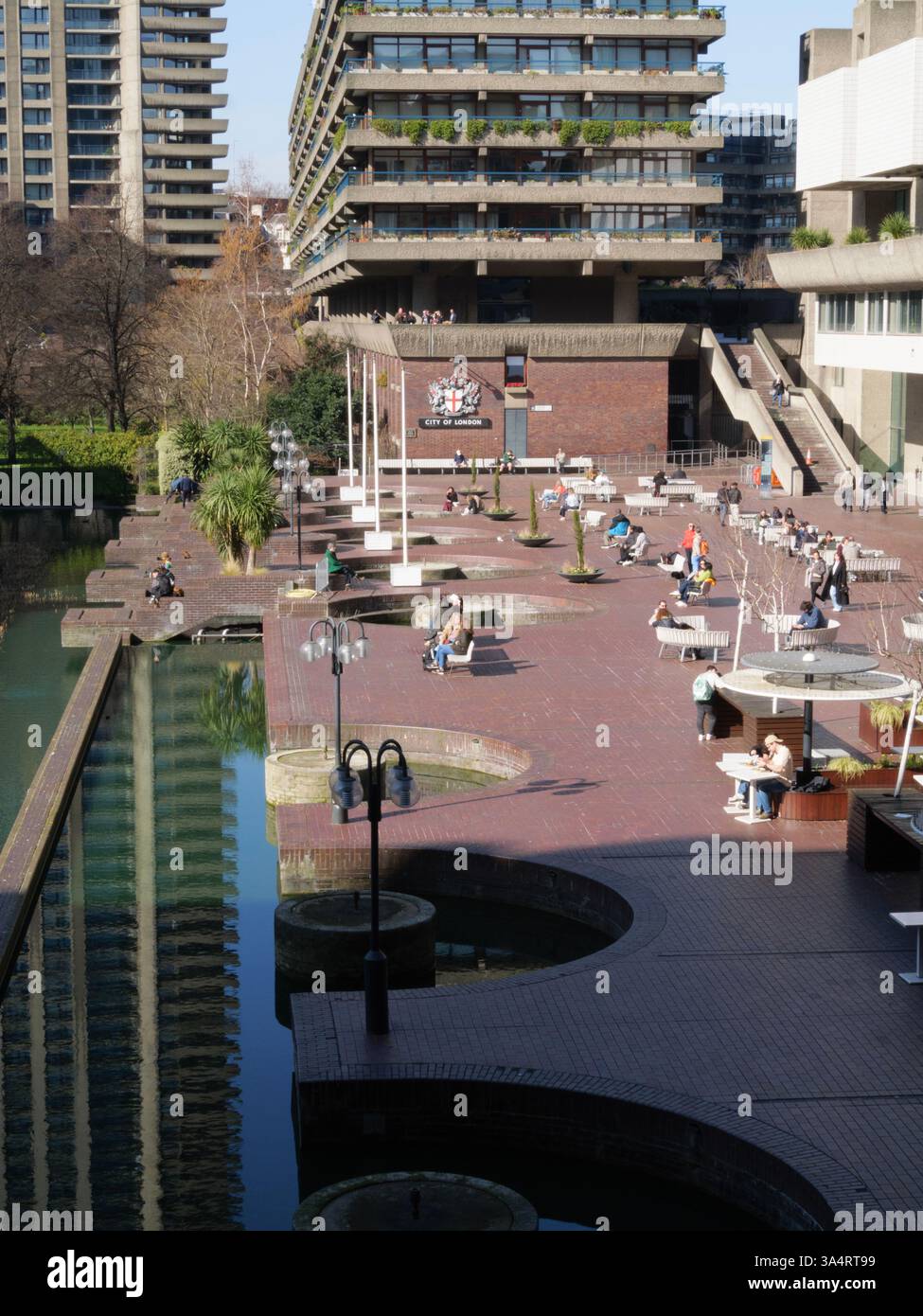 People enjoying the warm spring weather in Barbican Lakeside Terrace ...