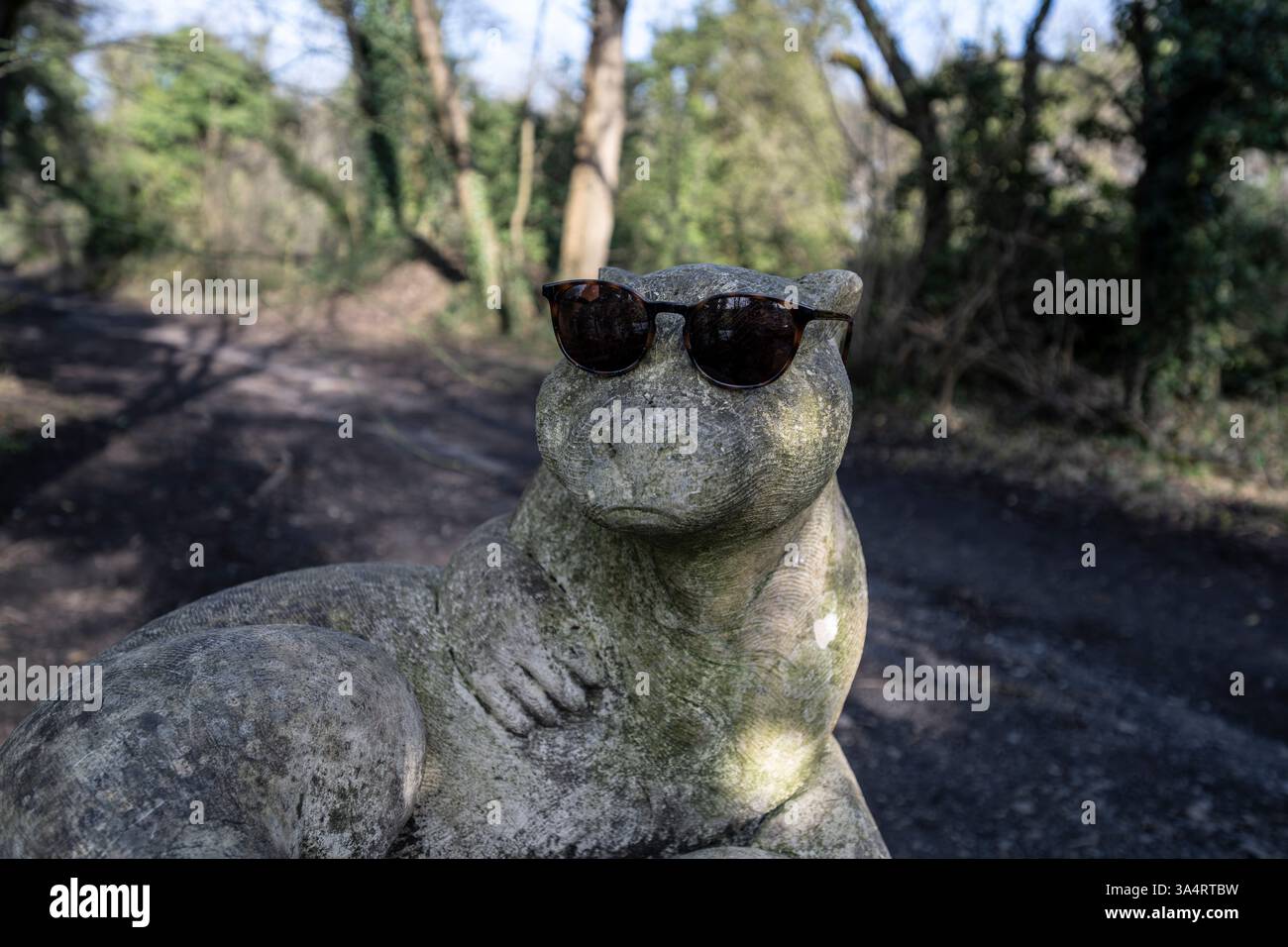 Someone has lost their sunglasses, Otter stone carving looking after ...