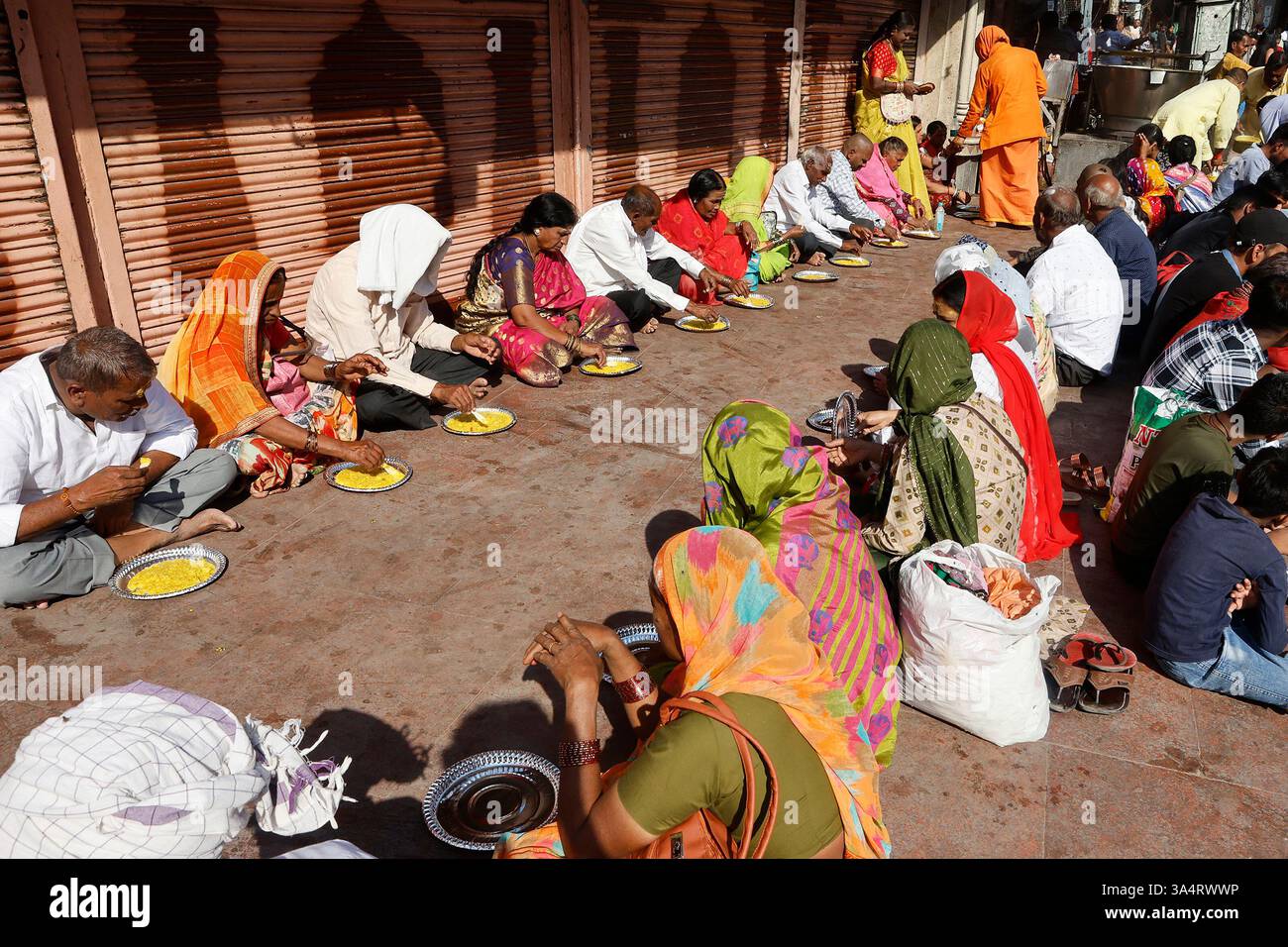 Food is distributed to the poor & homeless in Varanasi, Uttar Pradesh ...