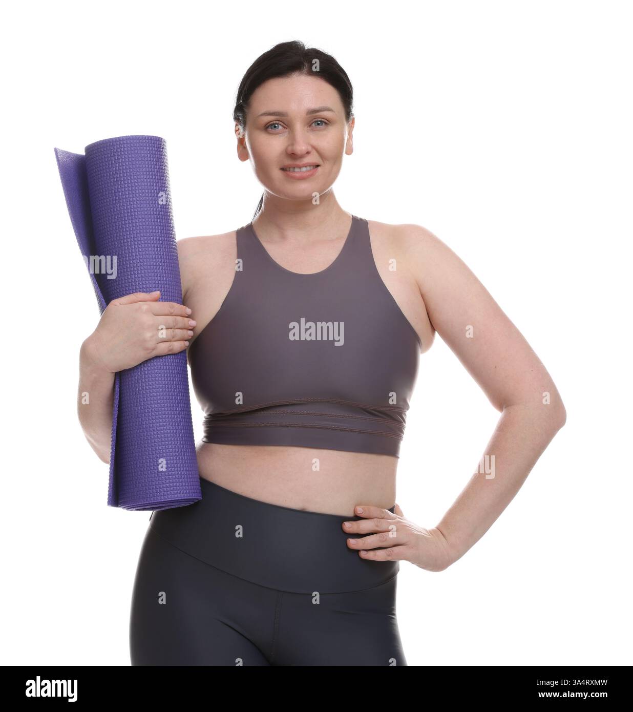 Plus size woman in gym clothes with fitness mat on white background ...