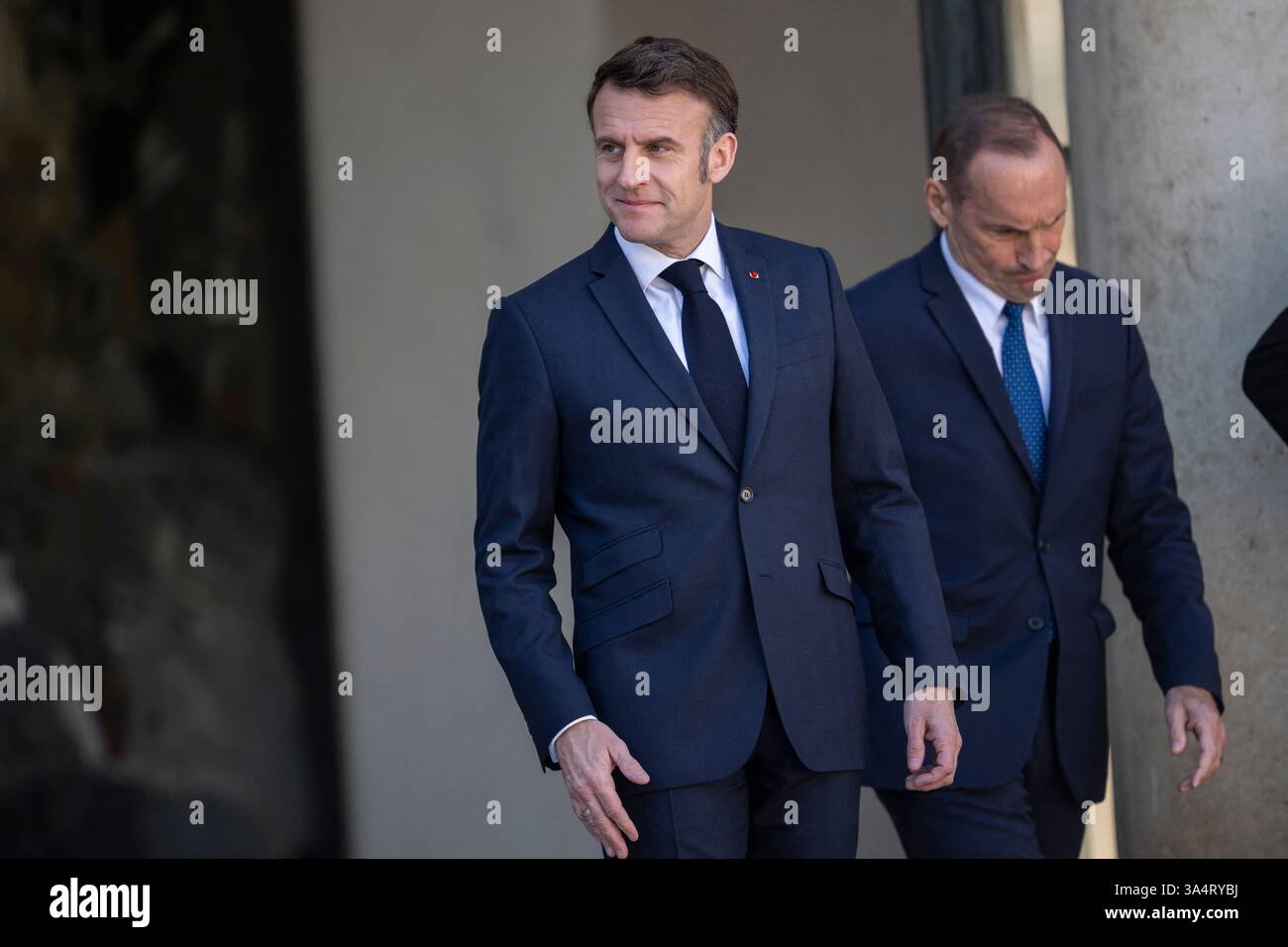 French President Emmanuel Macron gestures and looks at Elysee Palace in ...