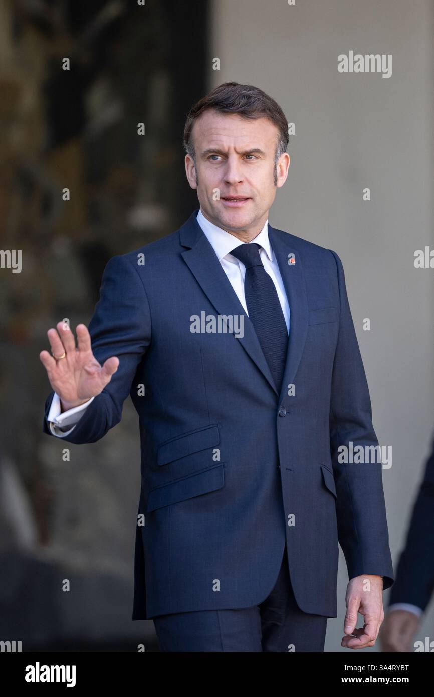 French President Emmanuel Macron gestures and looks at Elysee Palace in ...