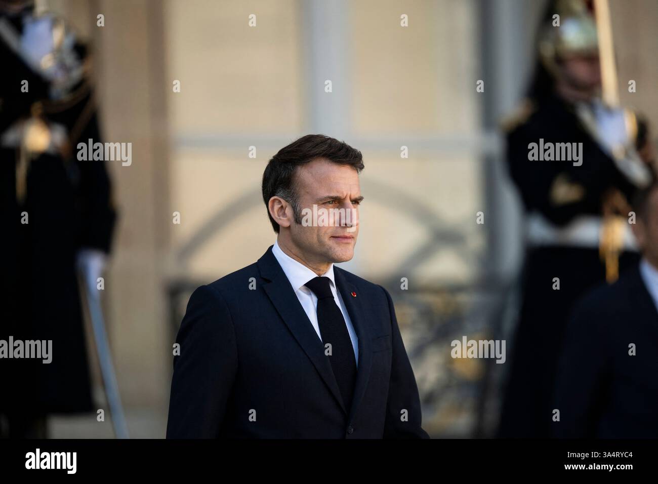 French President Emmanuel Macron gestures and looks at Elysee Palace in ...