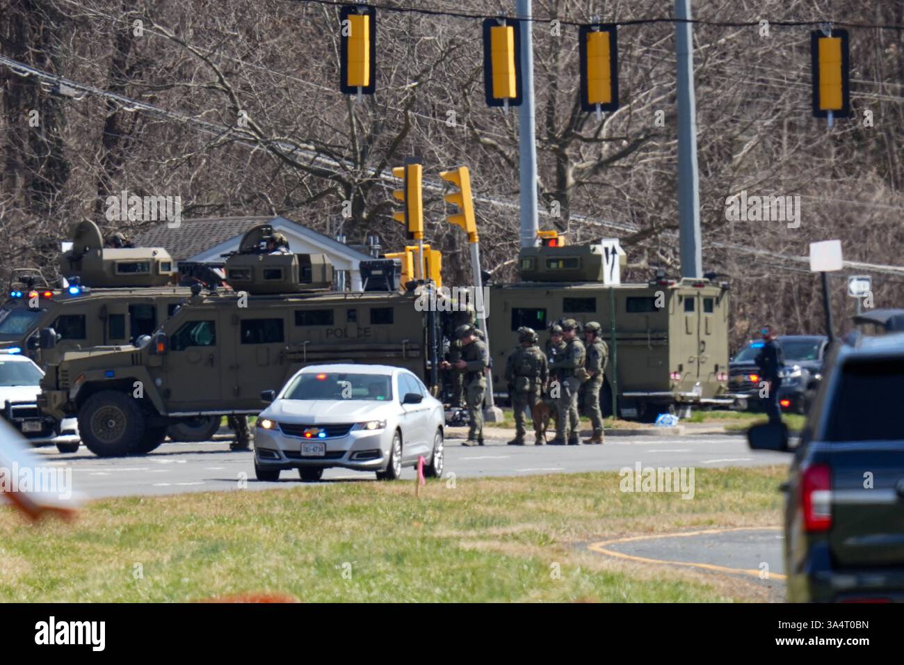March 19, 2025, Washington, District of Columbia, USA: A man with a gun ...